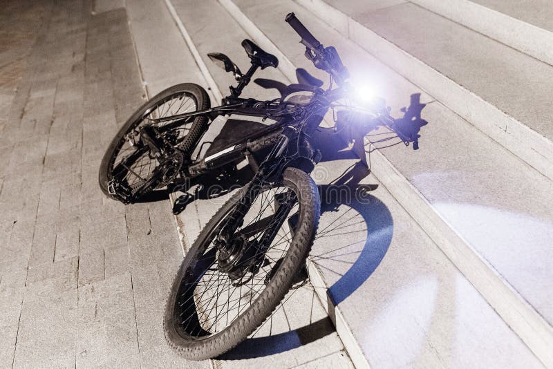 Bicycle Parked at Night on a City Street with a Light Lamp on Stock ...