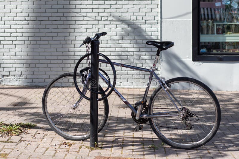 Bicycle Parked at a Street Rack on Sidewalk Editorial Photography ...