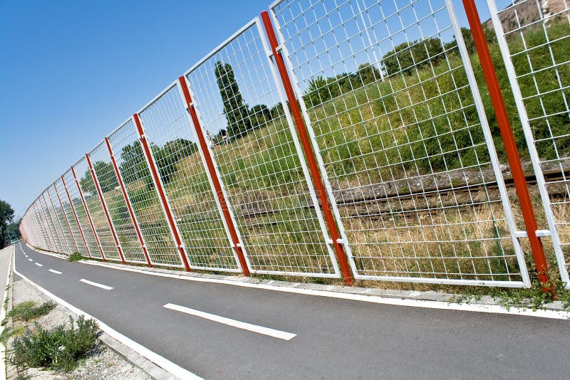Bicycle path and fence stock image. Image of city, blue - 25877983