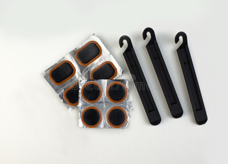 Bicycle Puncture Repair Kit on a White Stock Photo - Image of plastic ...