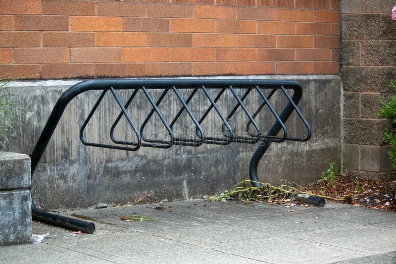 A Bicycle Rack by a Brick Building Stock Image - Image of bicycle ...