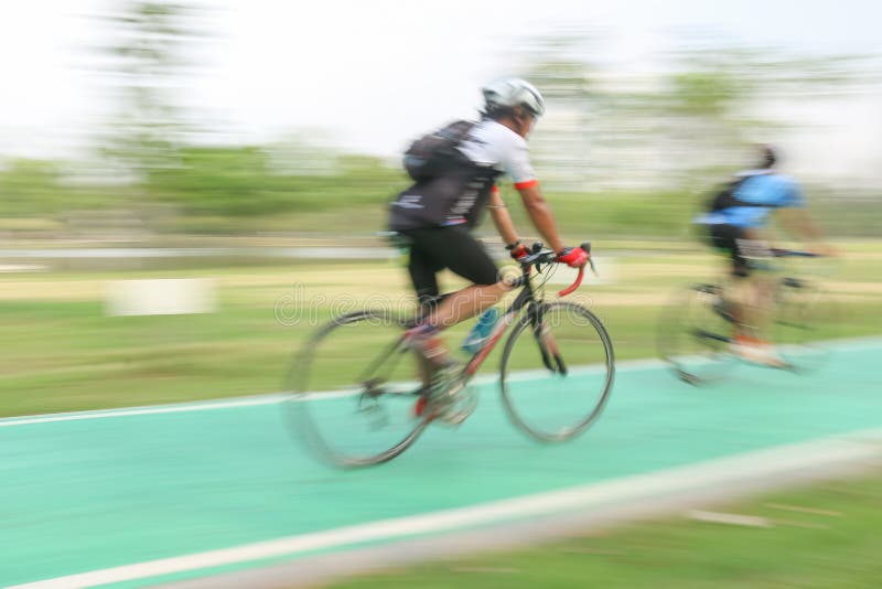Bicycle Rider on a Bicycle Path in Park Stock Photo - Image of rider ...