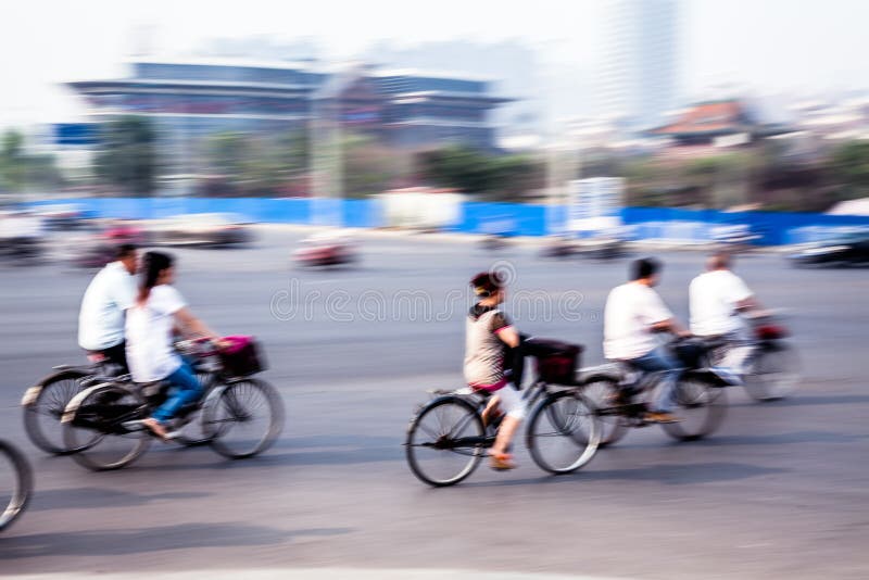 Bicycle riders in the city stock image. Image of blur - 45854451
