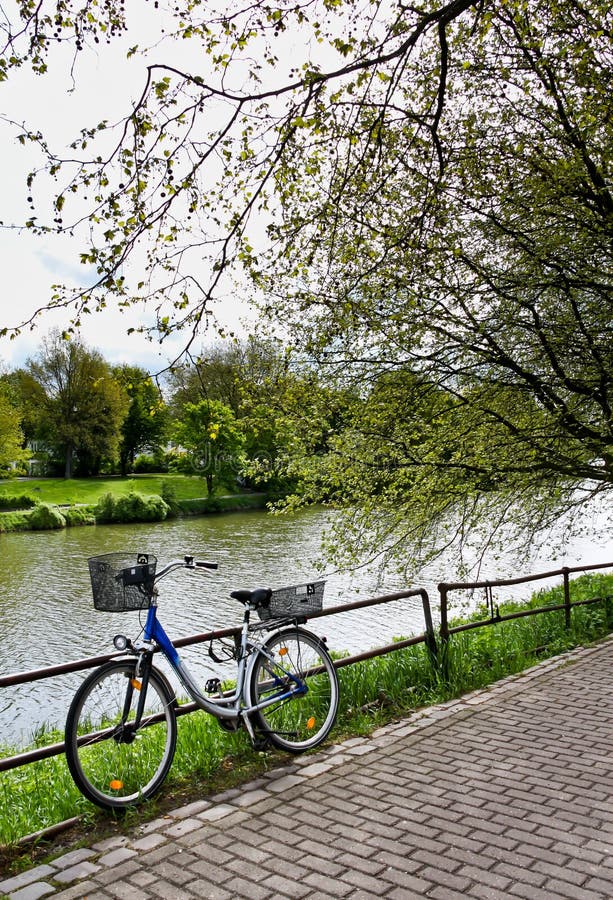 Bicycle at Riverside stock photo. Image of river, bremen - 16480174