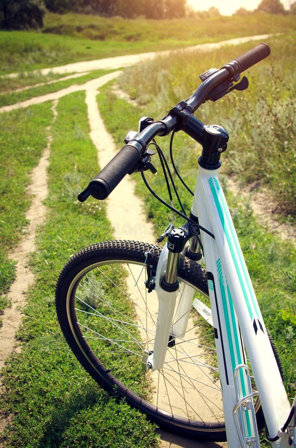 Bicycle on the road stock photo. Image of summer, biking - 75869854