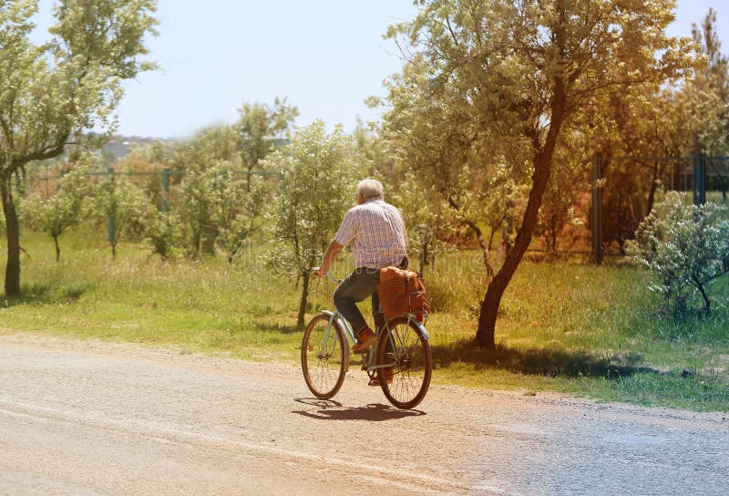 Riding with Grandpa on a Bike Editorial Stock Photo - Image of adult ...