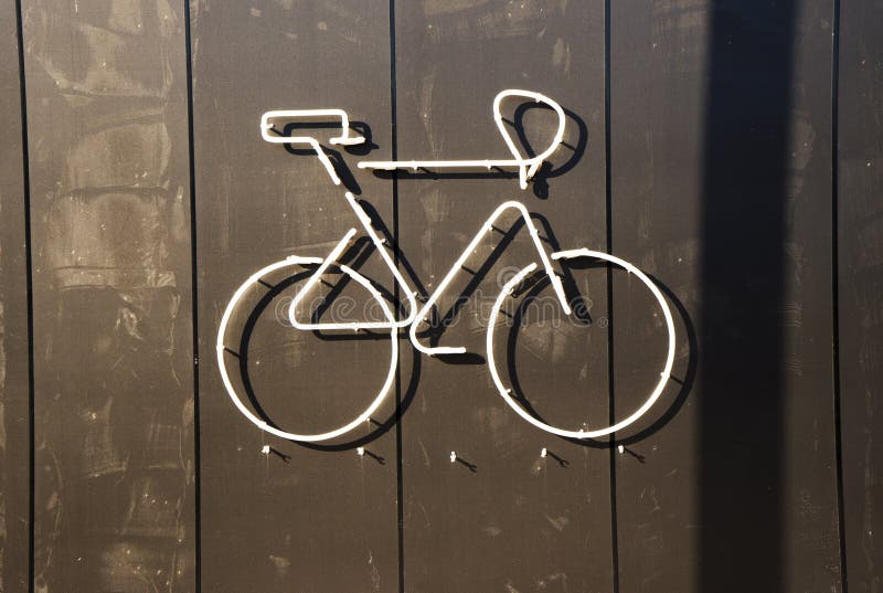 Bicycle Sign on a Black Wooden Wall Stock Image - Image of lifestyle ...