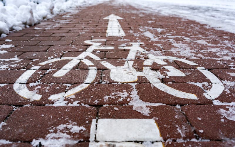The Bicycle Sign is Painted on the Asphalt with White Paint. Stock ...