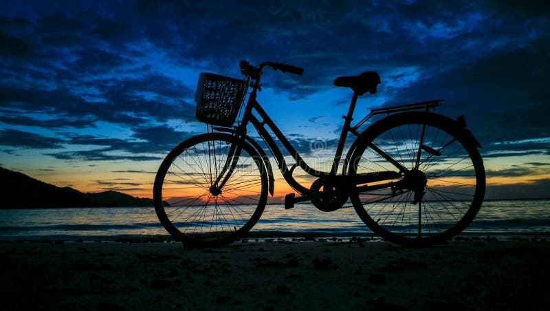 Bicycle on sunset beach stock photo. Image of hour, frame - 85326638