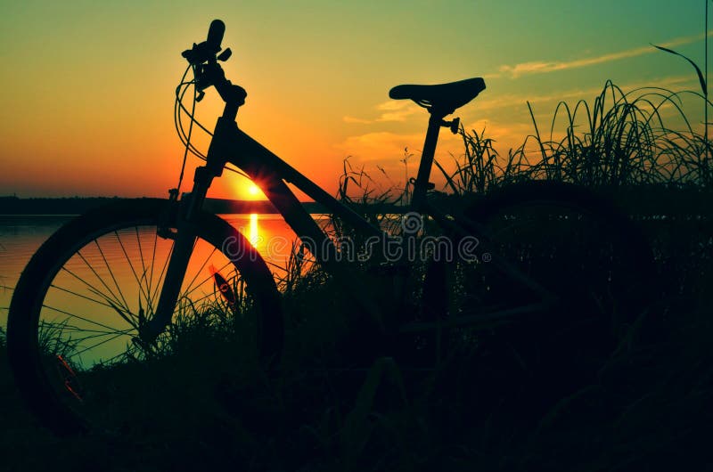 Bicycle and sunset stock image. Image of bicycle, loss - 48988281