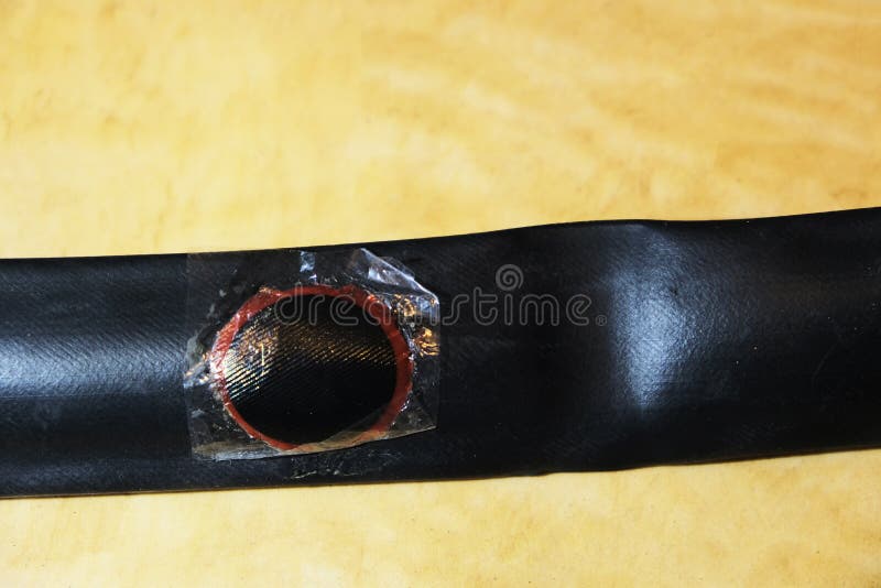 Bicycle Tire with Applied Patch Close Up on Yellow Stock Photo - Image ...