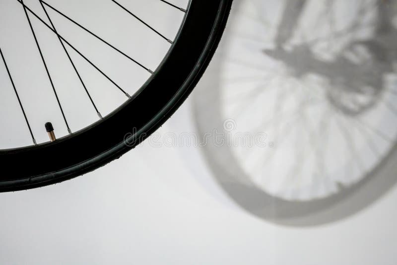 Bicycle Wheel Creating Silhouette Shadow on Wall Stock Photo - Image of ...