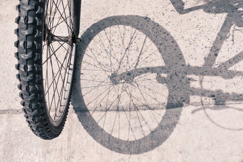 Bicycle wheel and shadow stock image. Image of abstract - 58505641