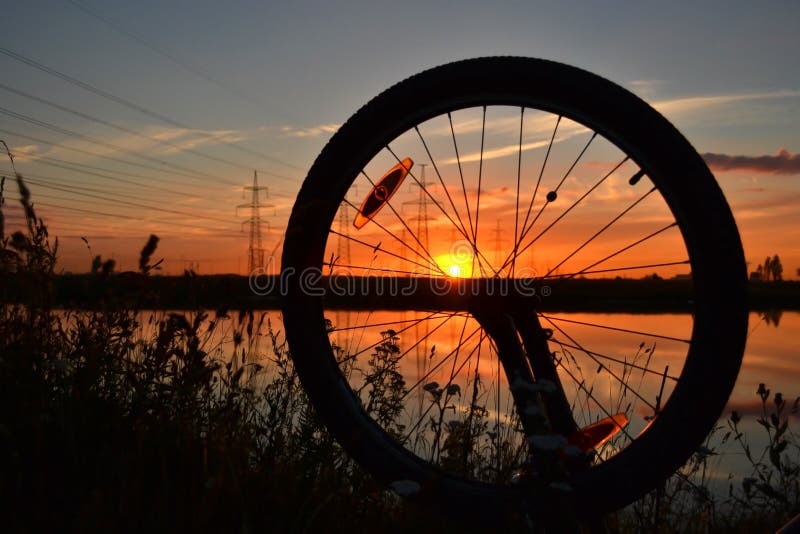Bicycle wheel at sunset stock image. Image of sports - 26389777