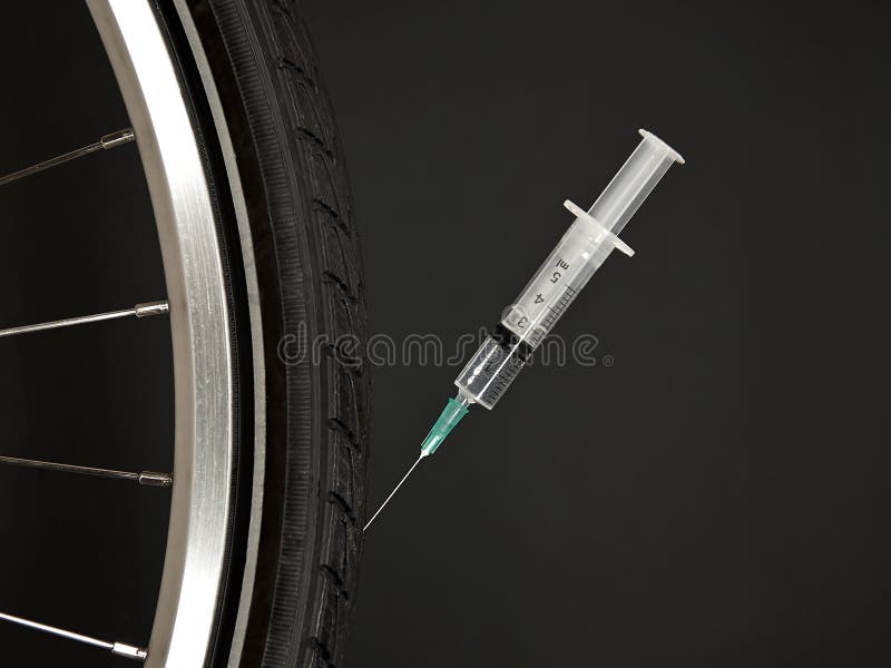 Bicycle Wheel with a Syringe in it Stock Photo - Image of syringe ...