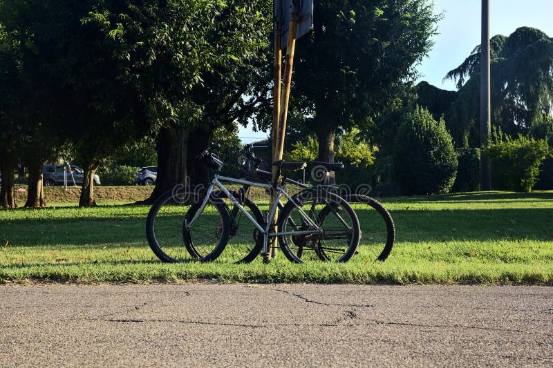 Bicycles Chained To a Pole on an Open Space Stock Photo - Image of ...