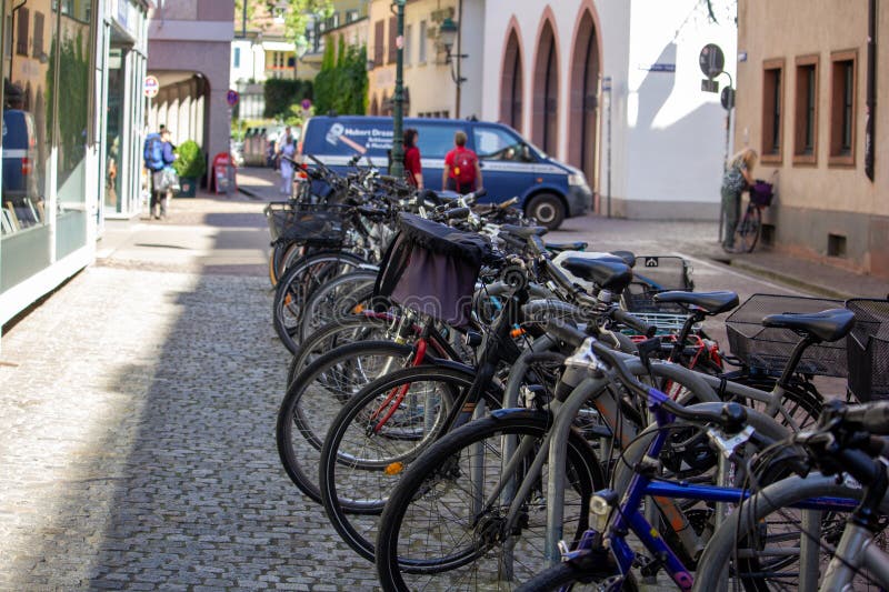 Bicycles Parked on a Cobblestone Street in Germany Editorial Stock ...