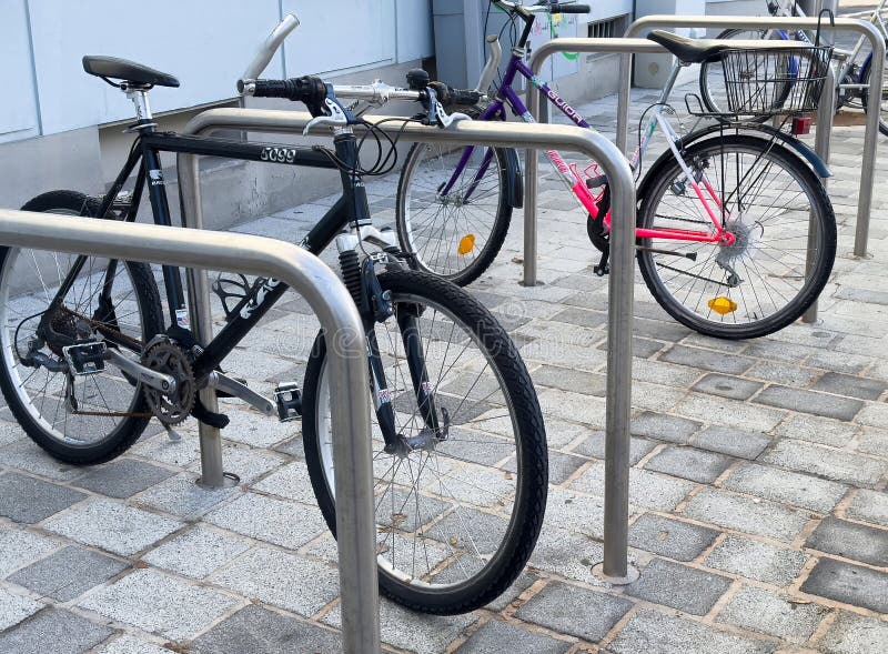 Bicycles Parked at Urban Bike Rack on Paved Sidewalk Editorial Photo ...