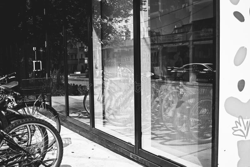 Bicycles Reflected in Storefront Windows Stock Photo - Image of ...
