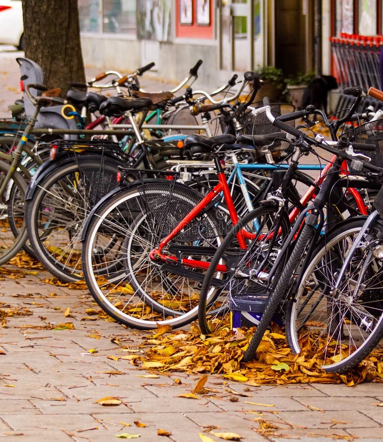 Bicycles on a Sidewalk in City Stock Photo - Image of vehicle, saddle ...