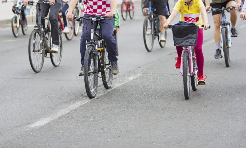 Bicyclists in Traffic on the Streets Stock Photo - Image of road ...