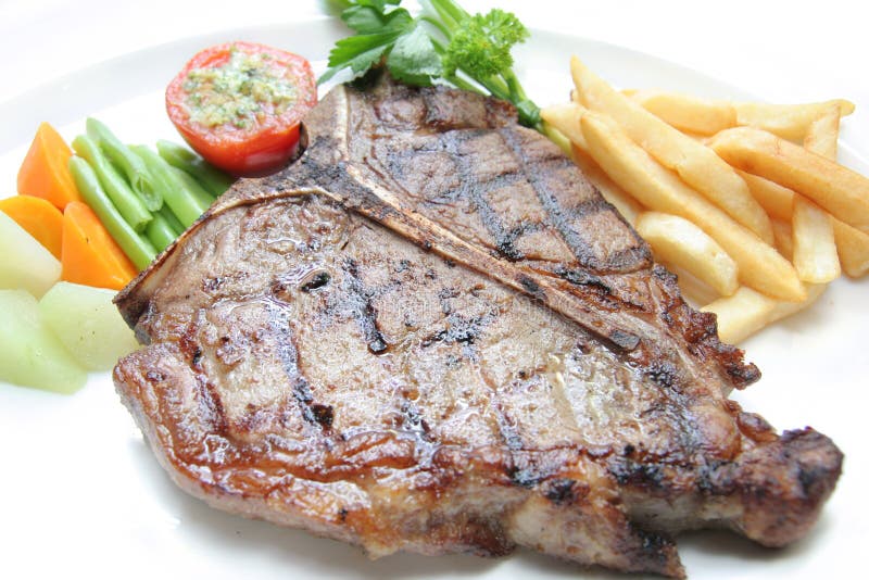 Bife de T-bone imagem de stock. Imagem de bife, vegetal - 7662491