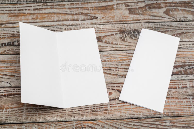 Bifold White Template Paper on Wood Texture . Stock Image - Image of ...