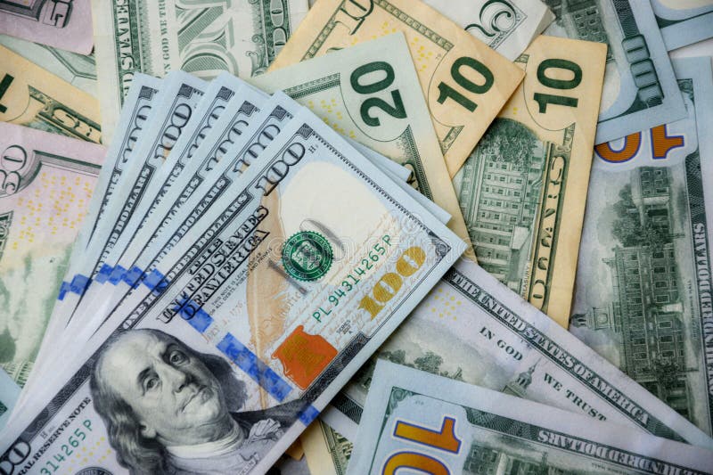 Big Amount of US Dollar Bills in Different Nominations on Table. Many ...