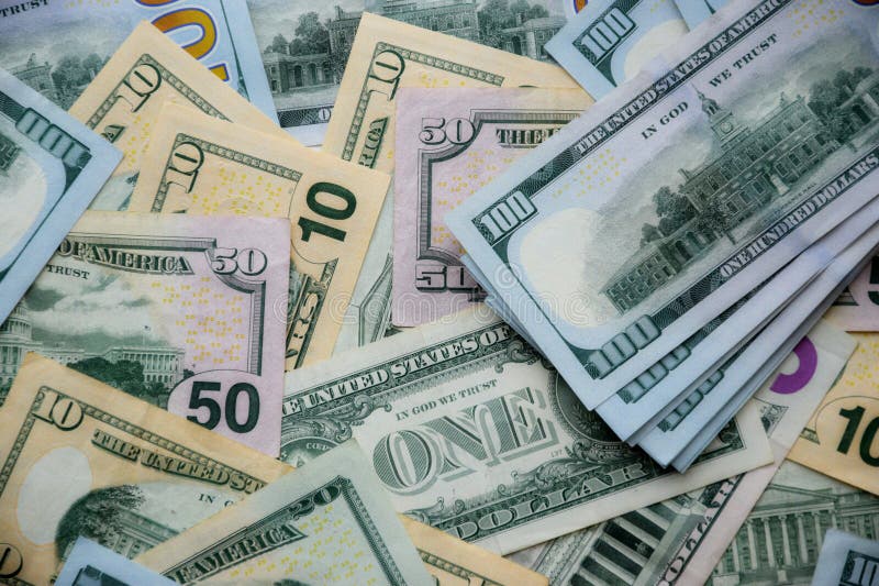 Big Amount of US Dollar Bills in Different Nominations on Table. Many ...