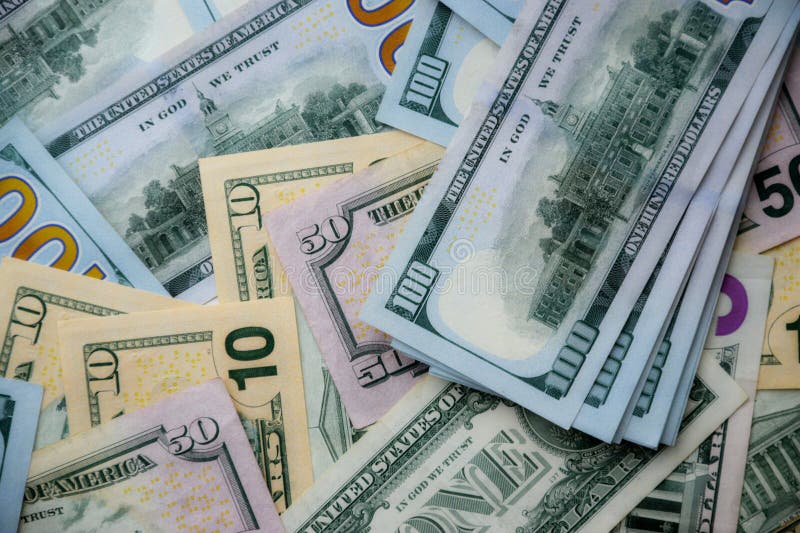 Big Amount of US Dollar Bills in Different Nominations on Table. Many ...