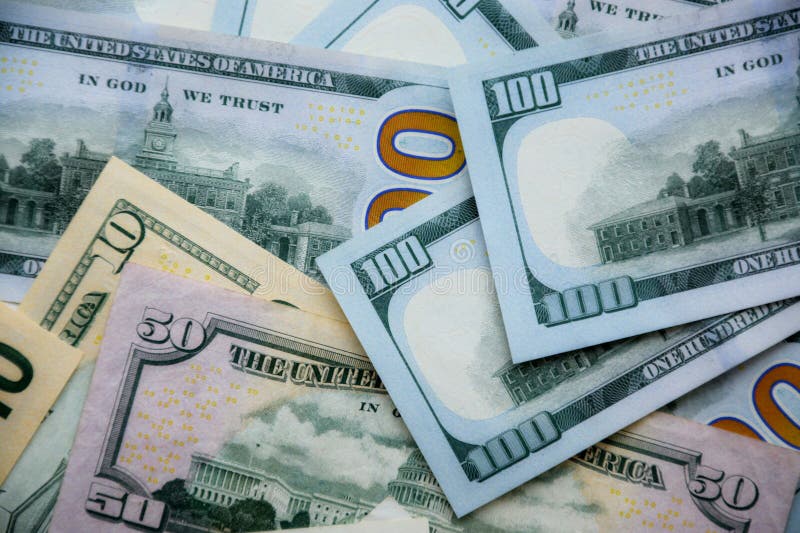 Big Amount of US Dollar Bills in Different Nominations on Table. Many ...