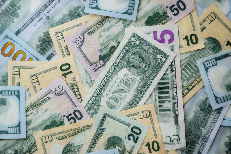 Big Amount of US Dollar Bills in Different Nominations on Table. Many ...