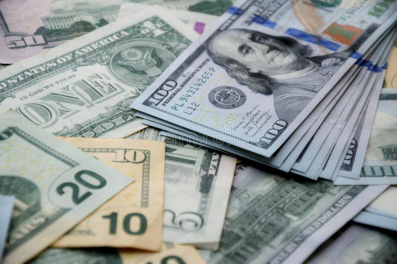 Big Amount of US Dollar Bills in Different Nominations on Table. Many ...