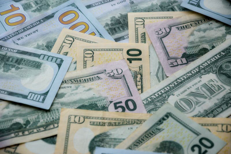 Big Amount of US Dollar Bills in Different Nominations on Table. Many ...