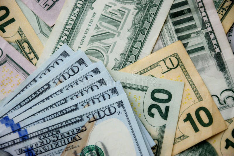 Big Amount of US Dollar Bills in Different Nominations on Table. Many ...