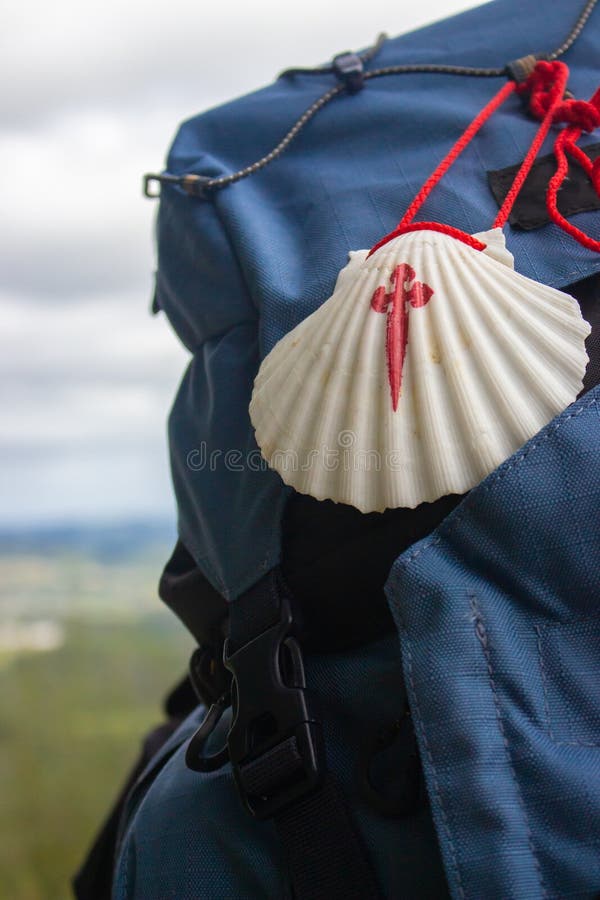 Big Backpack with Pilgrim Shell on Mountain Background. Pilgrimage ...