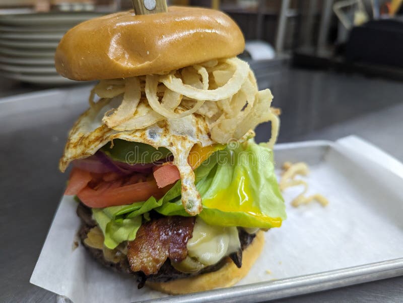 Big Bacon Cheeseburger stock photo. Image of bacon, meal - 357373306