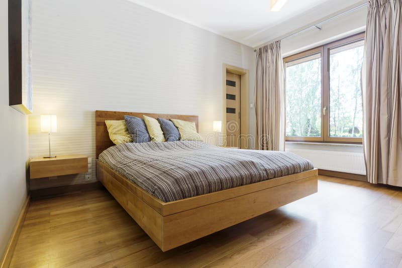 Big bed in the bedroom stock photo. Image of home, modern - 81601098
