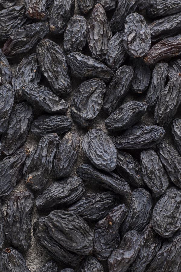 Big Black Raisins on the Table. Stock Photo - Image of tasty, vertical ...