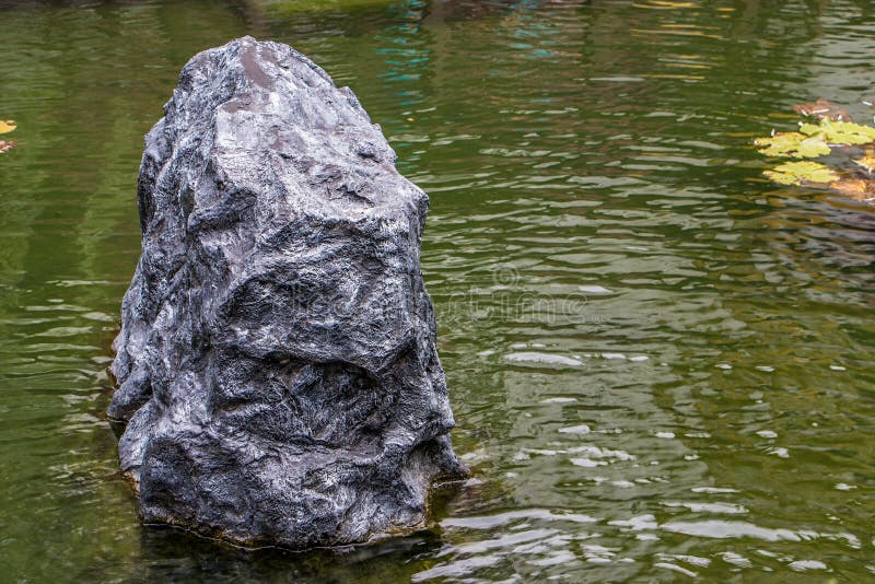 Big Black Stones in Water Garden Background Stock Photo - Image of ...