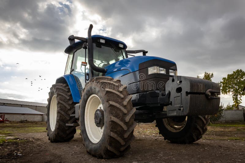 Big blue modern tractor stock photo. Image of agriculture - 233678942