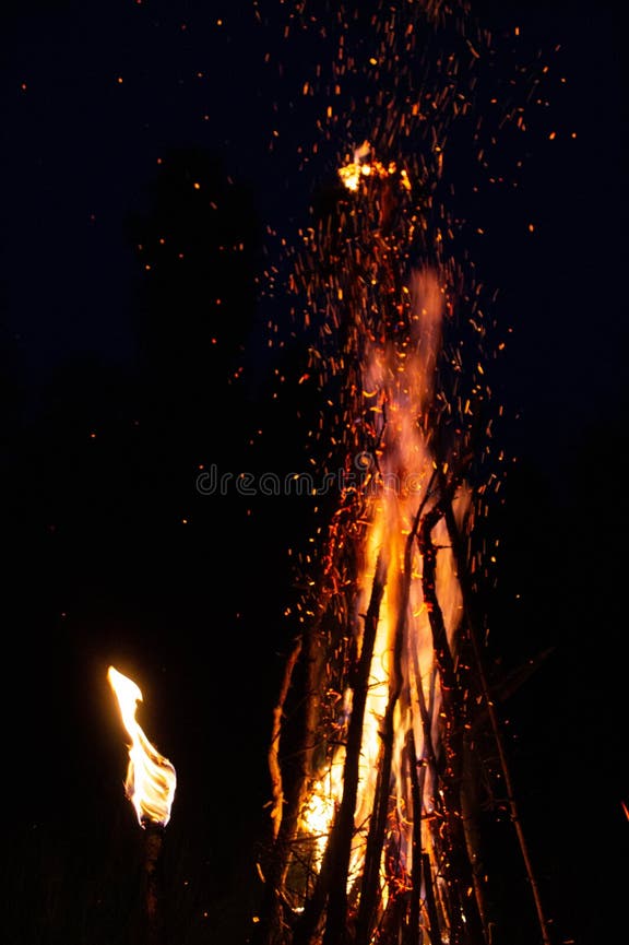 A big bonfire with a torch stock illustration. Illustration of religion ...