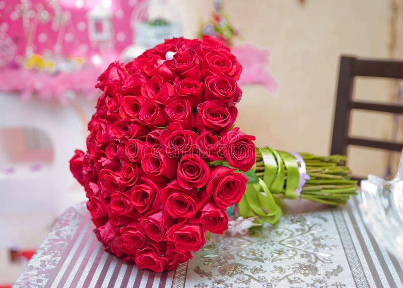 Big Bouquet of One Hundred Big Red Roses Flowers on the Table . a ...