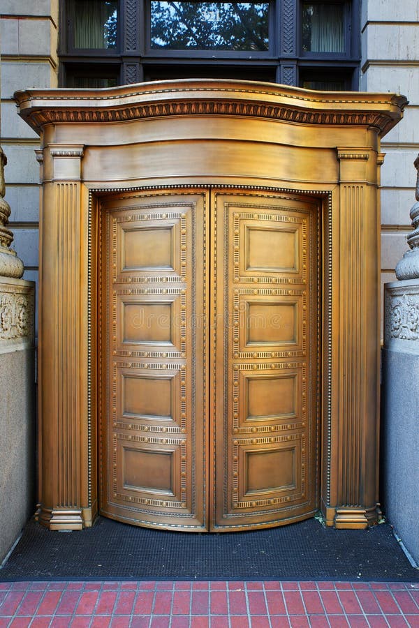 Big Brass Revolving Bank Doors Stock Image - Image of exterior ...
