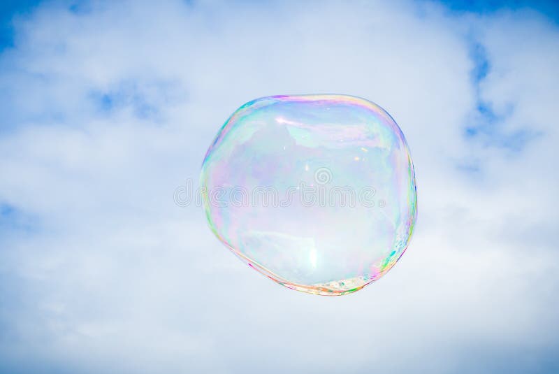 Big Bubble of Bubble Maker Flying in the Air on Sky Background Stock ...