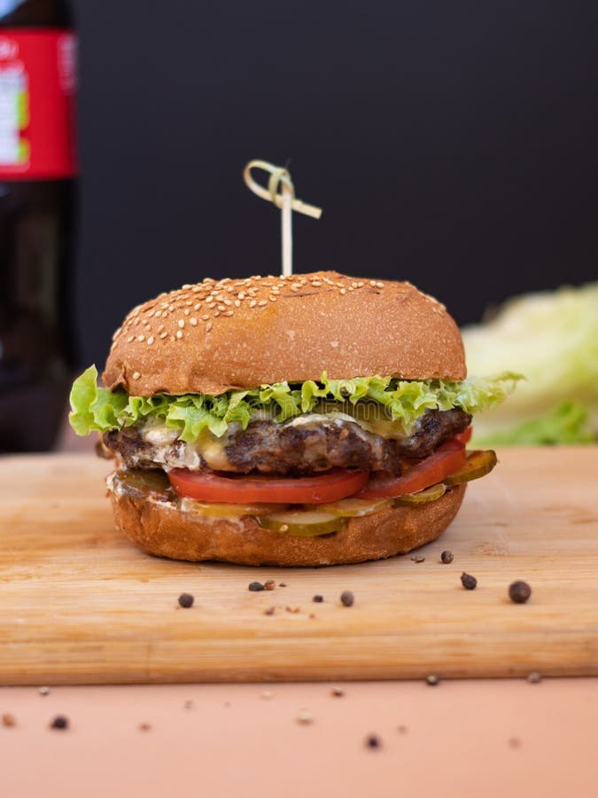 Big Burger in a Cafe on a Wooden Table Stock Image - Image of snack ...