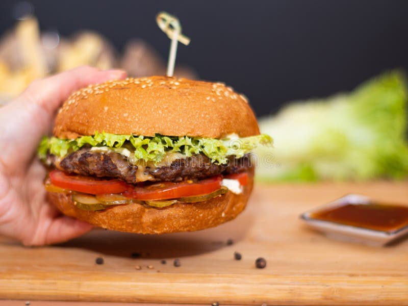 Big Burger in a Cafe on a Wooden Table Stock Photo - Image of bistro ...