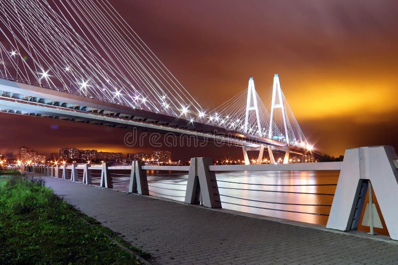 Big Cable-stayed Bridge Over the River at Night with Colorful Bright ...