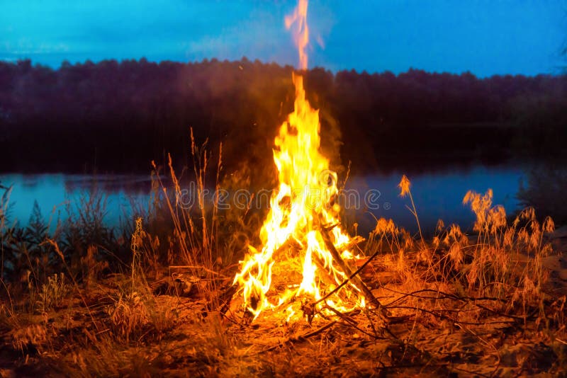 Big Campfire at Night in the Forest Stock Photo - Image of campsite ...