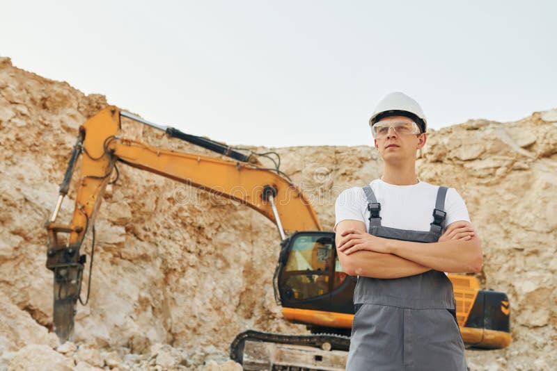 Big Career. Worker in Professional Uniform is on the Borrow Pit at ...